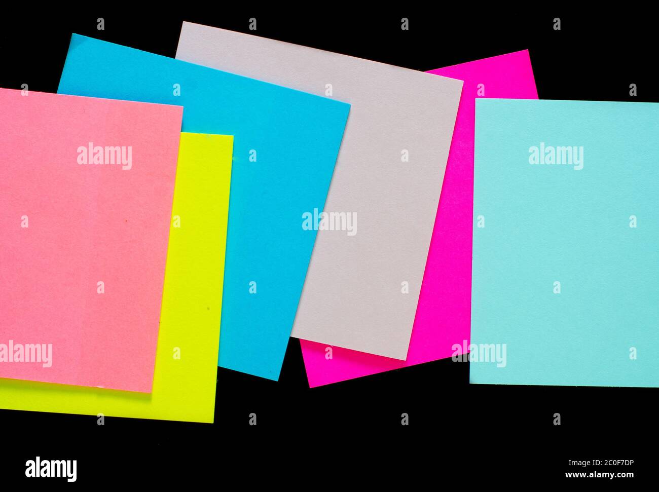 color sheets for note on black background Stock Photo - Alamy