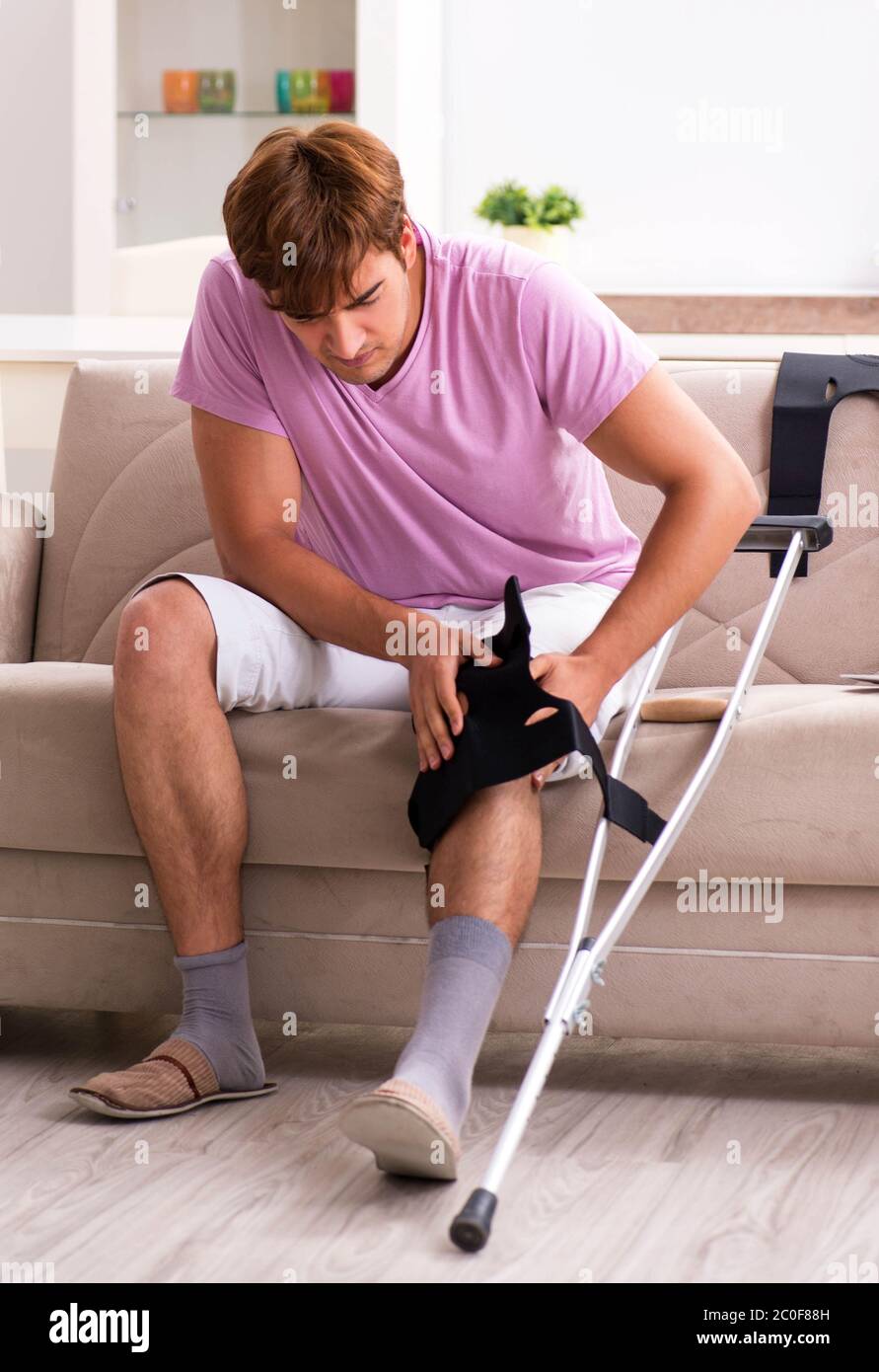 The injured man recovering at home from sports injury Stock Photo - Alamy