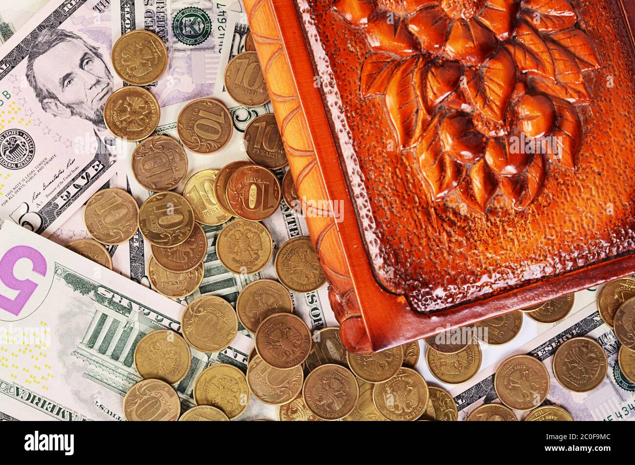 Coins and banknotes in the box Stock Photo - Alamy