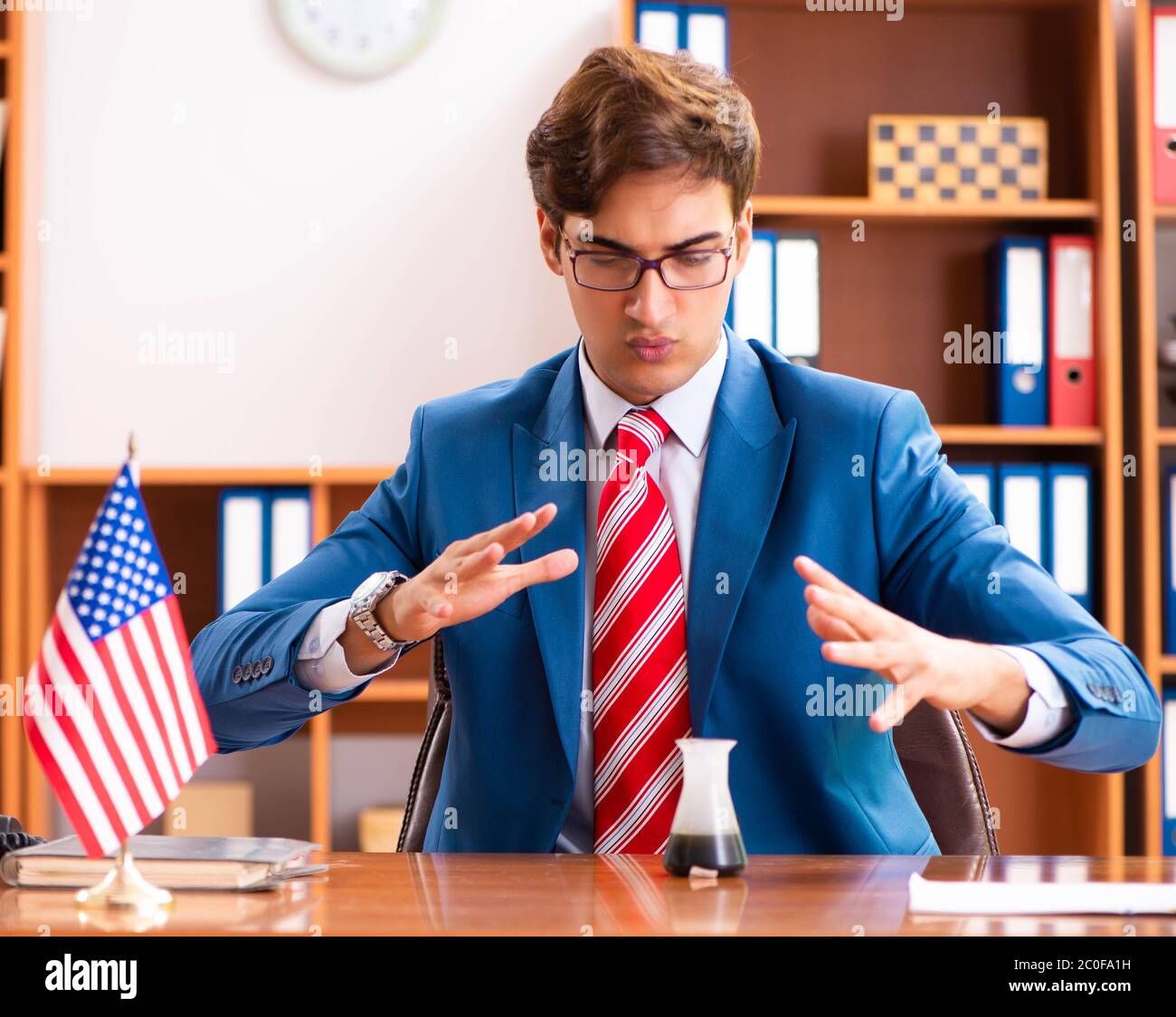 The young handsome politician sitting in office Stock Photo - Alamy
