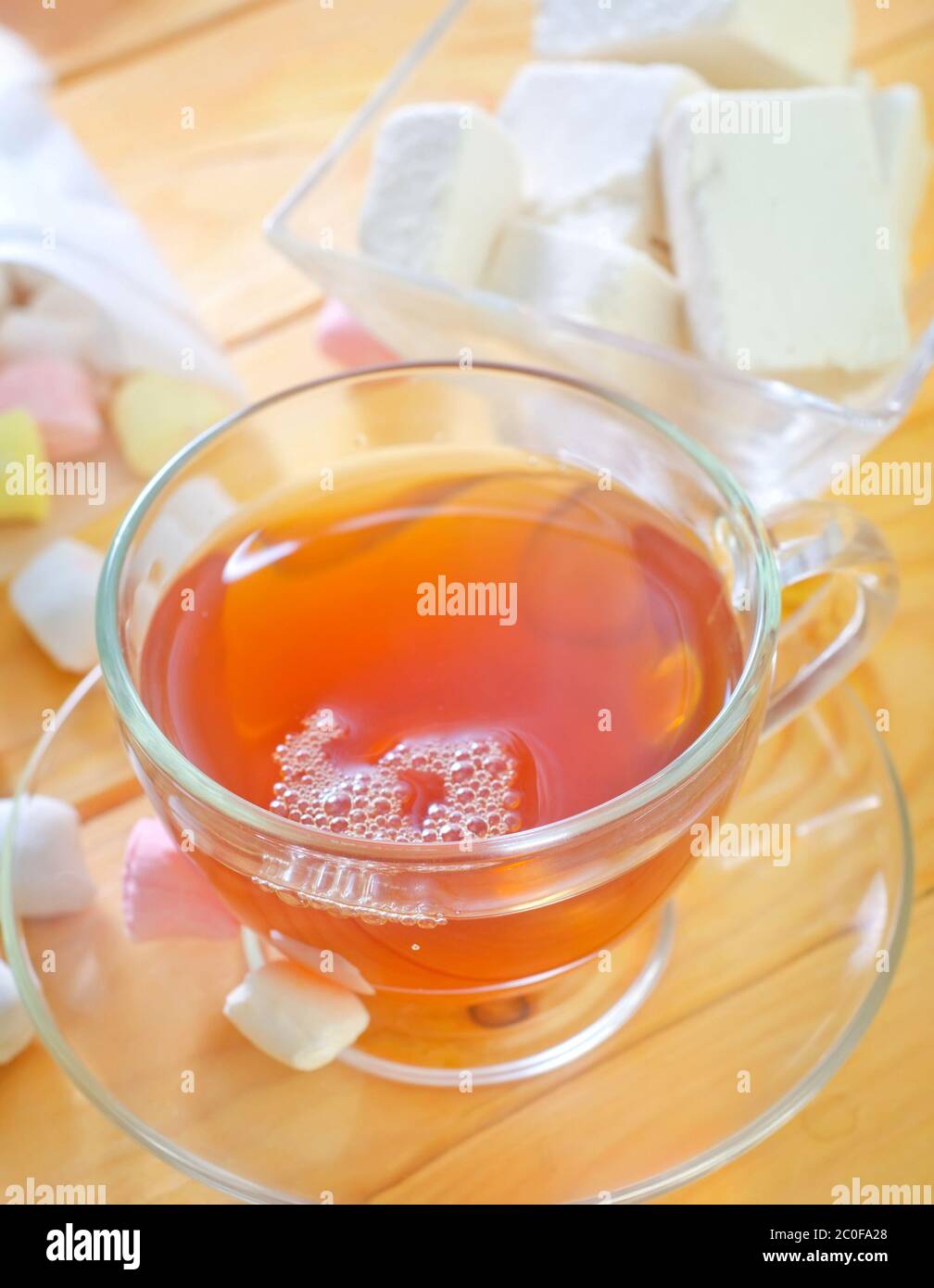Fresh tea with candy Stock Photo - Alamy