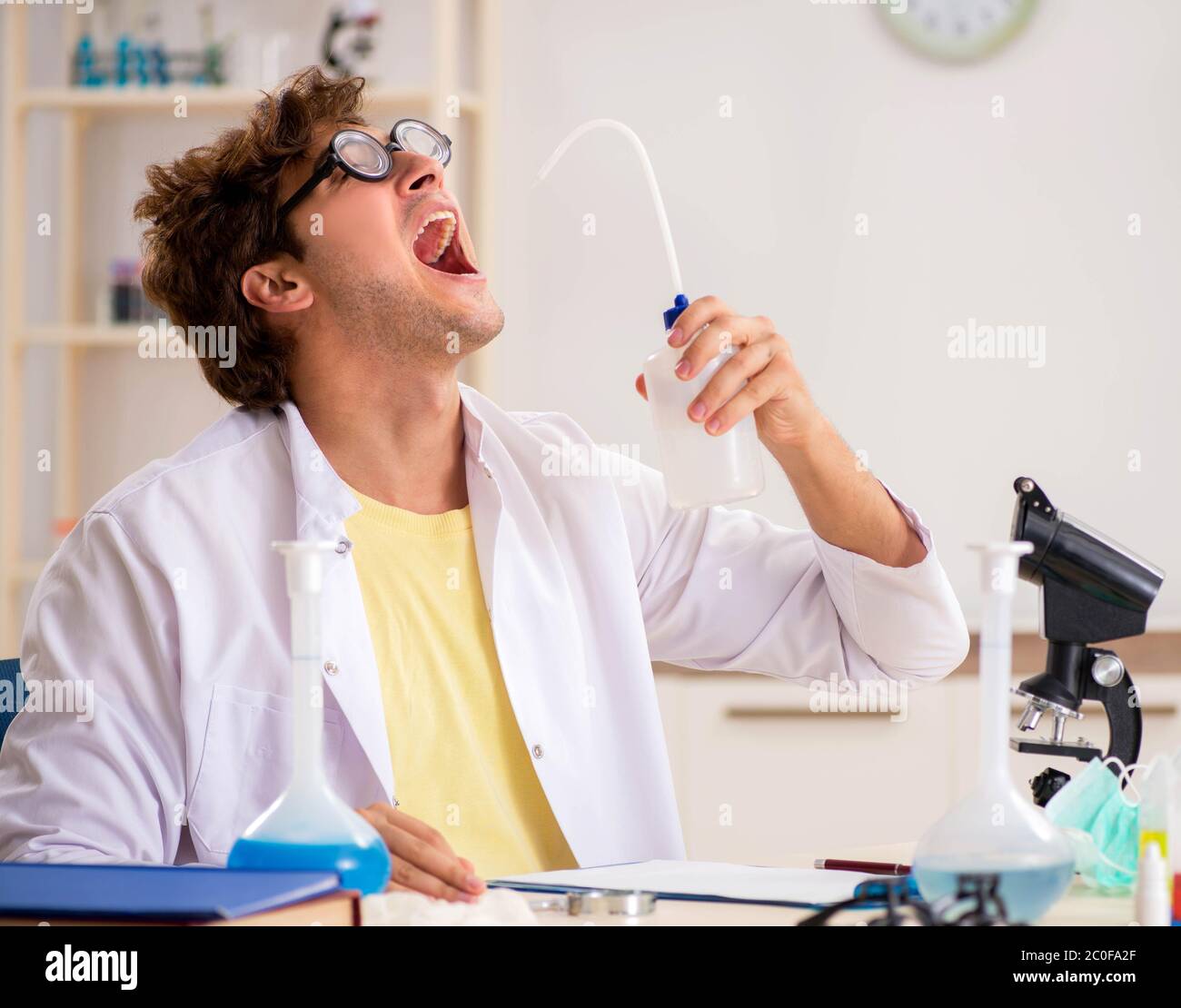 The funny crazy chemist doing experiments and tests Stock Photo - Alamy
