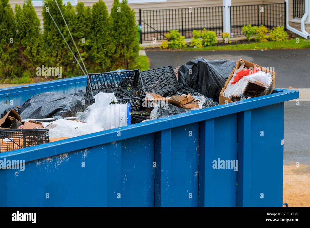 Construction trash dumpsters on metal container, house renovation Stock ...