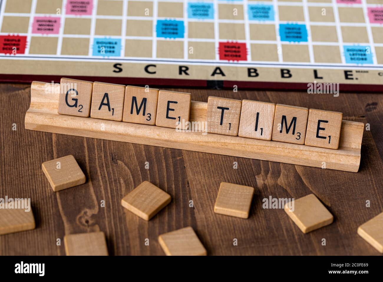 Scrabble board game with the scrabble tile spelling "Game Time" on ...