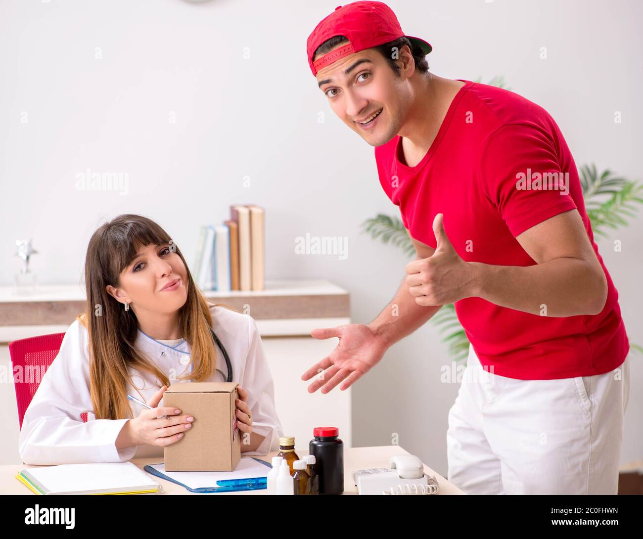 Woman delivering medicines hi-res stock photography and images - Alamy
