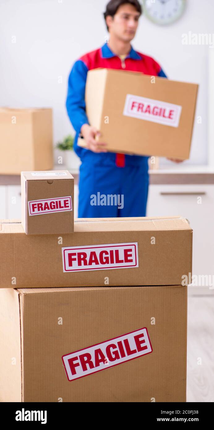 The transportation contractor with fragile boxes Stock Photo - Alamy
