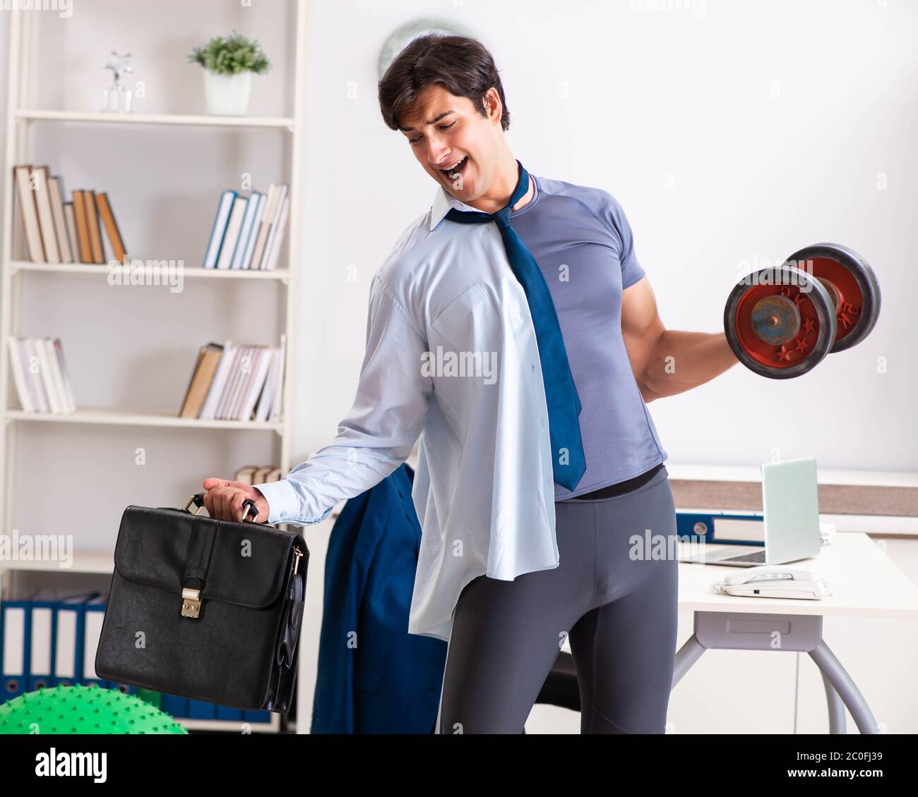 The employee combining work and healthy lifestyle Stock Photo - Alamy