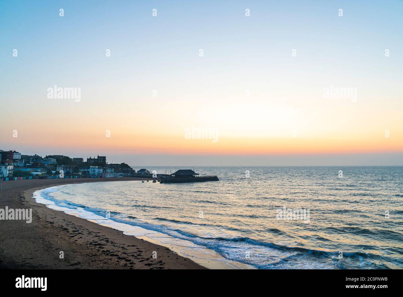 Landscape, the dawn sky over the calm North sea and Broadstairs resort ...