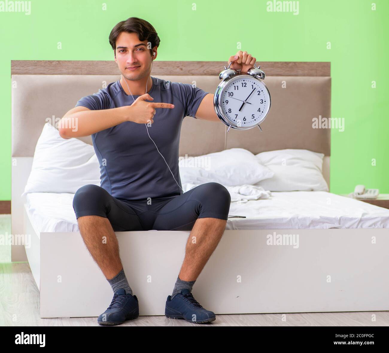 The young handsome man doing morning exercises in the hotel room Stock ...