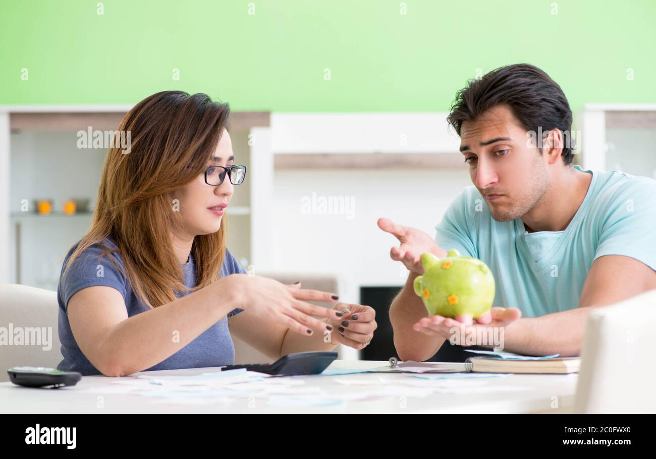 The young family struggling with personal finance Stock Photo - Alamy