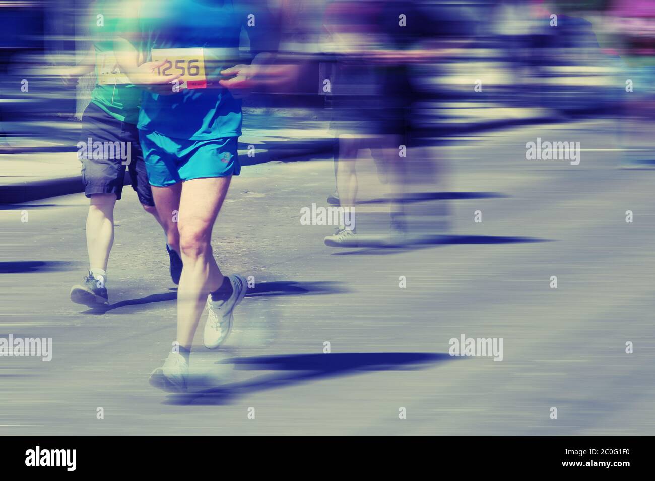 Detail of a marathon runner in full action. Group of Runners, emotional ...