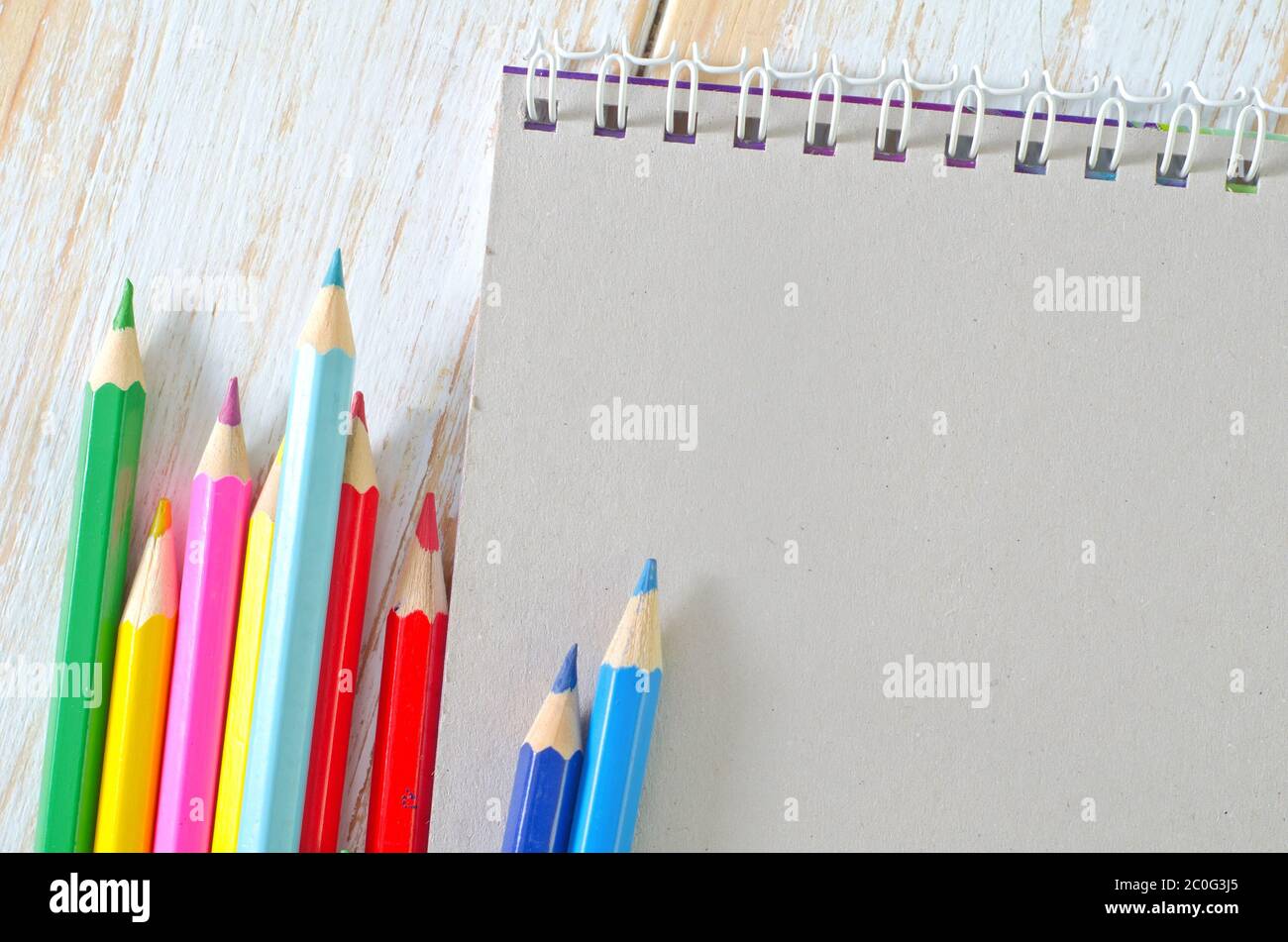 note and pencils Stock Photo - Alamy