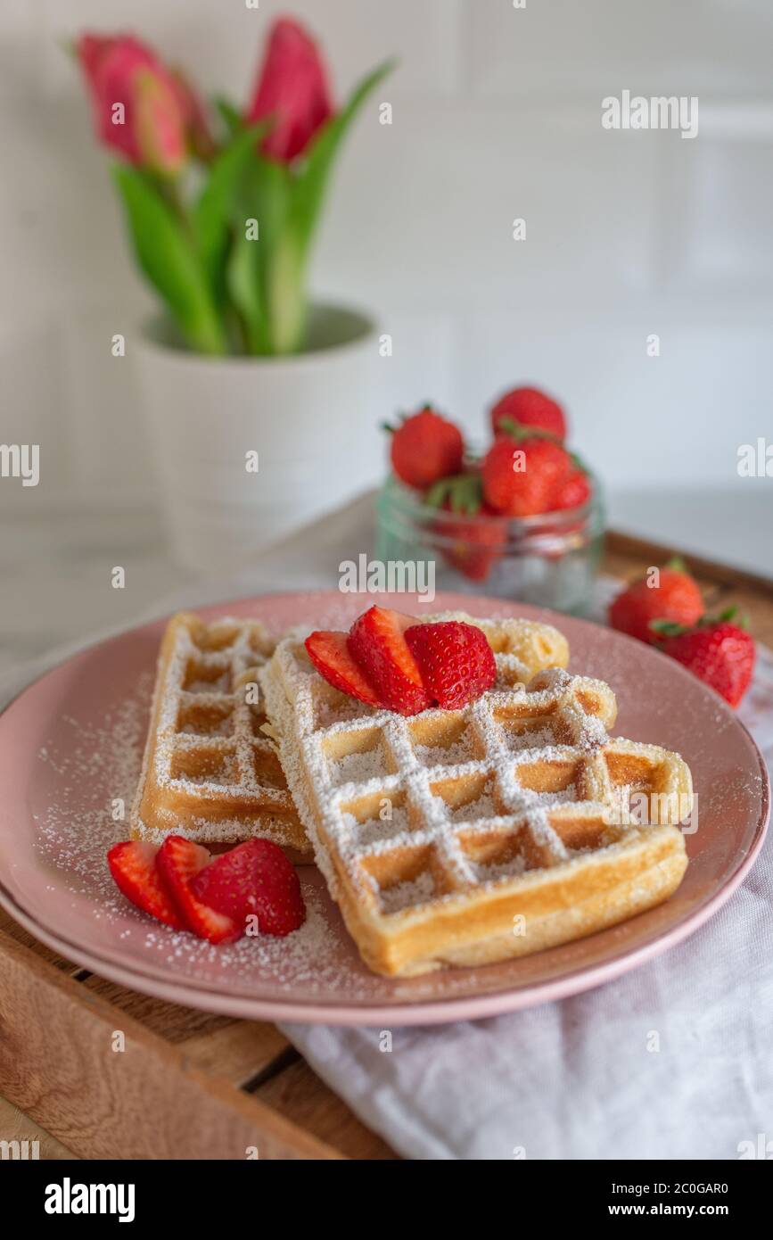 Sweet crispy waffles with strawberries Stock Photo - Alamy