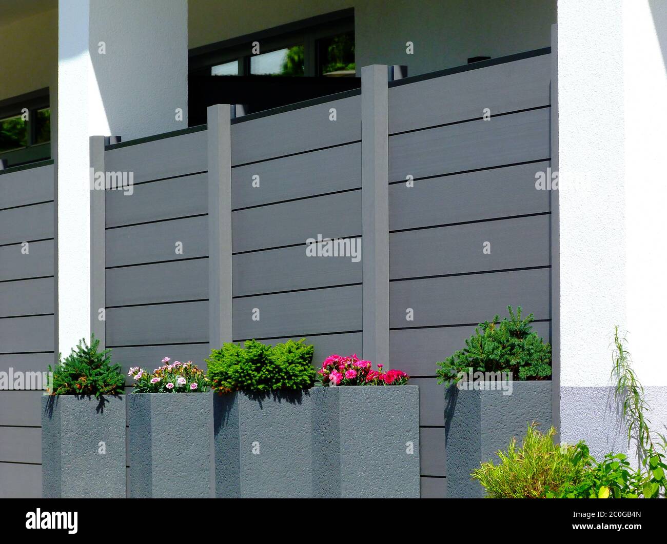 gray textured vertical clay or ceramic planters with colorful pink ...
