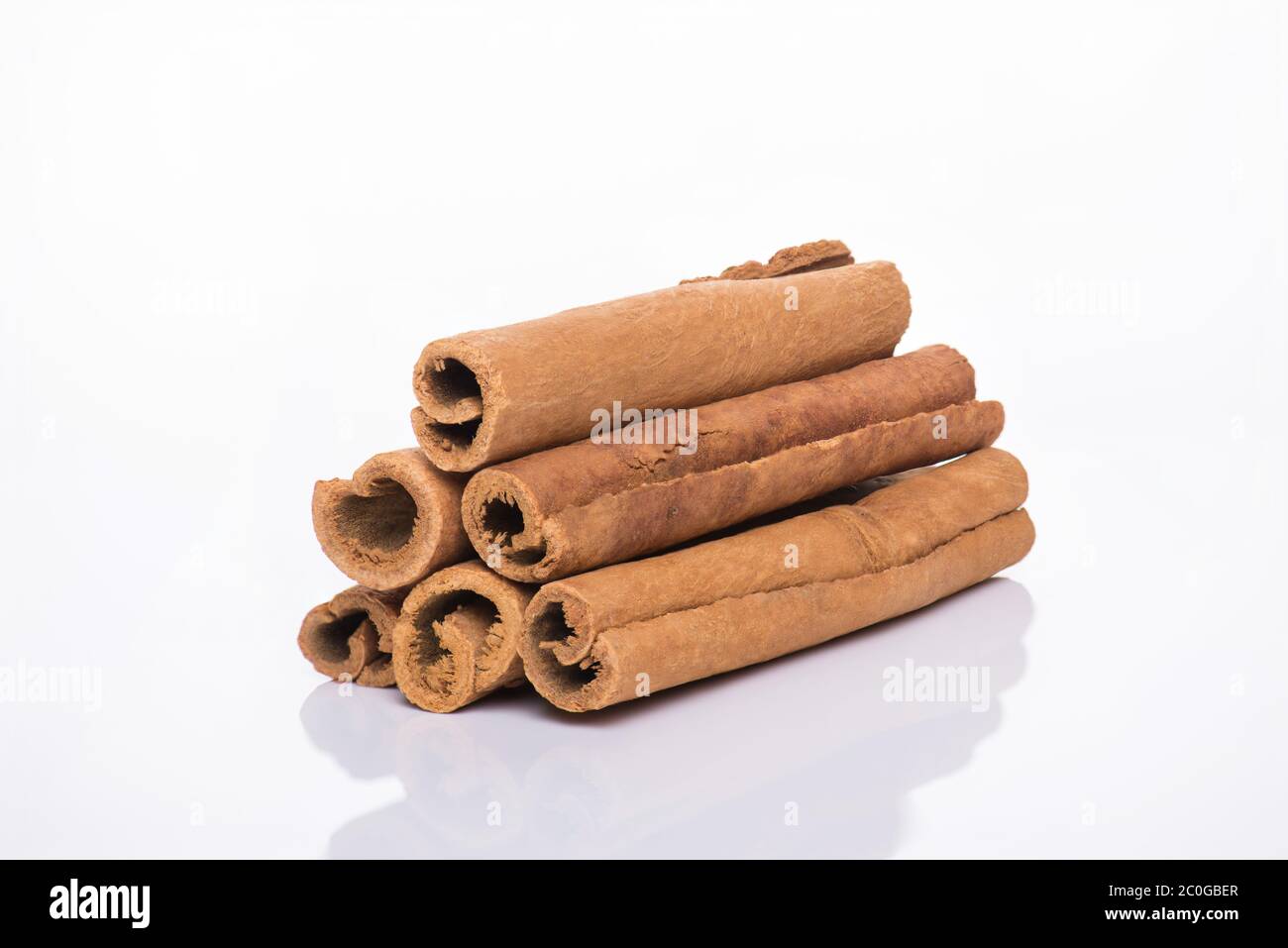 Close-up photo of a stack of cinnamon sticks isolated on white ...