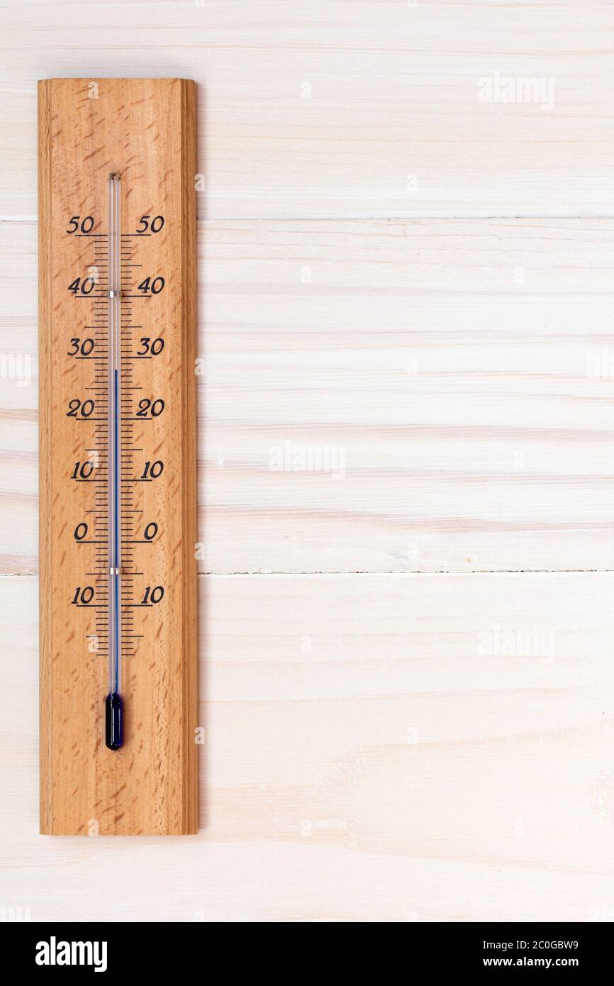 Thermometer on wooden background Stock Photo - Alamy