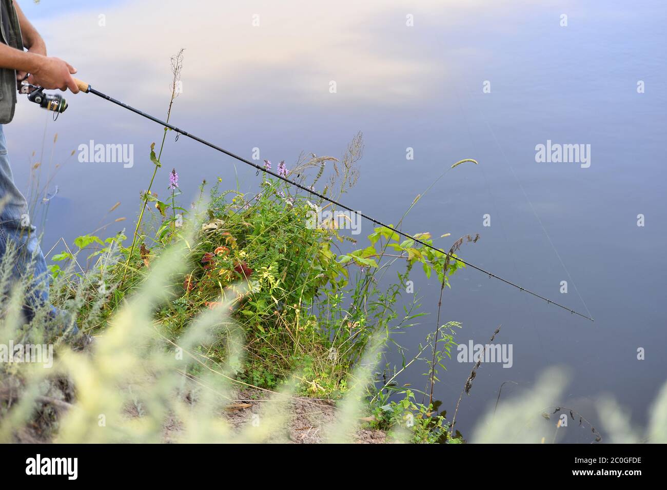 Hands holding fishing rod river hi-res stock photography and images - Alamy