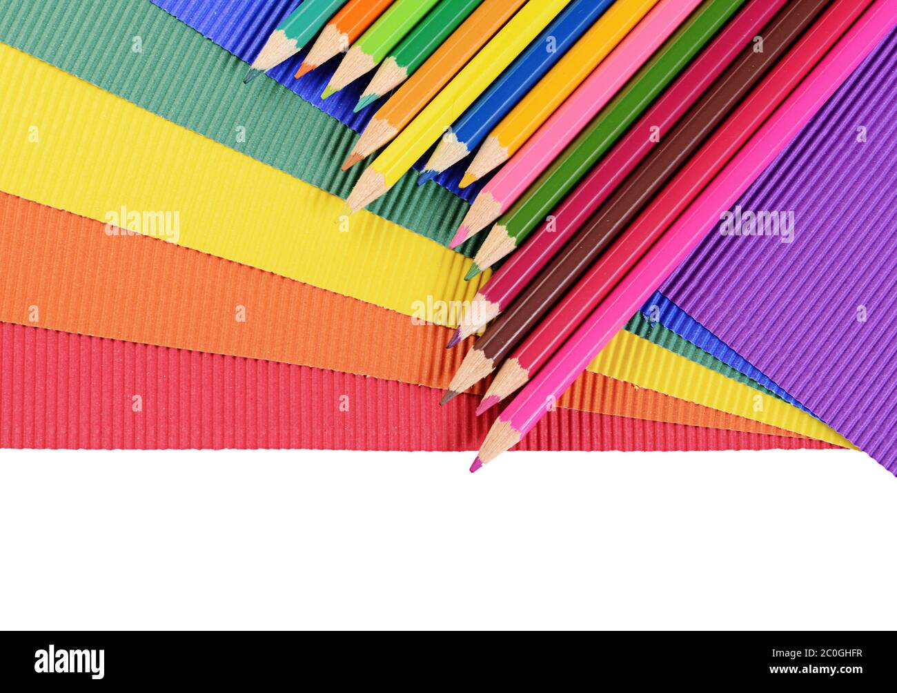 Color pencils on multi-colored paper Stock Photo - Alamy