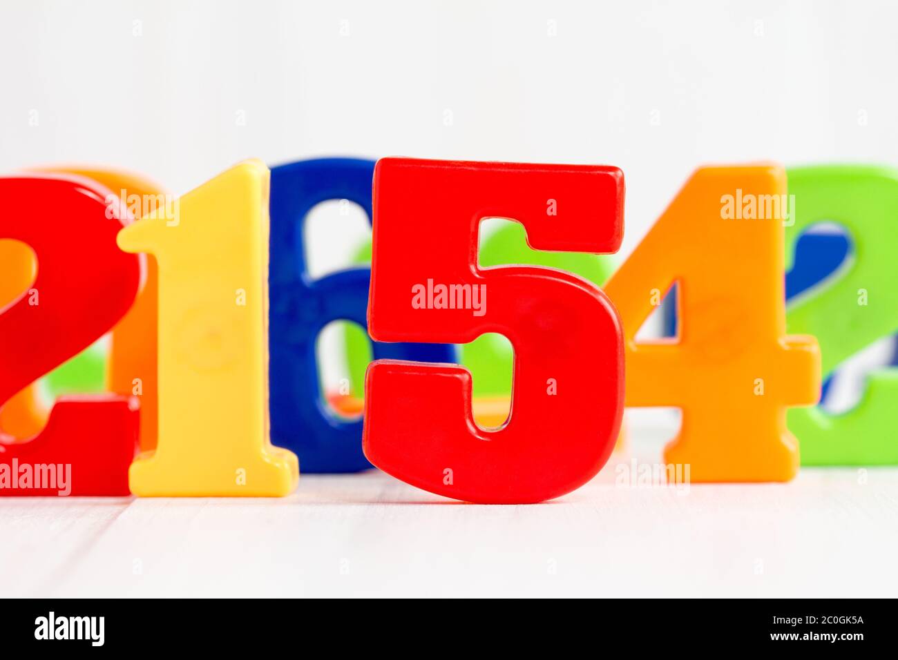 Playing with colored numbers Stock Photo - Alamy