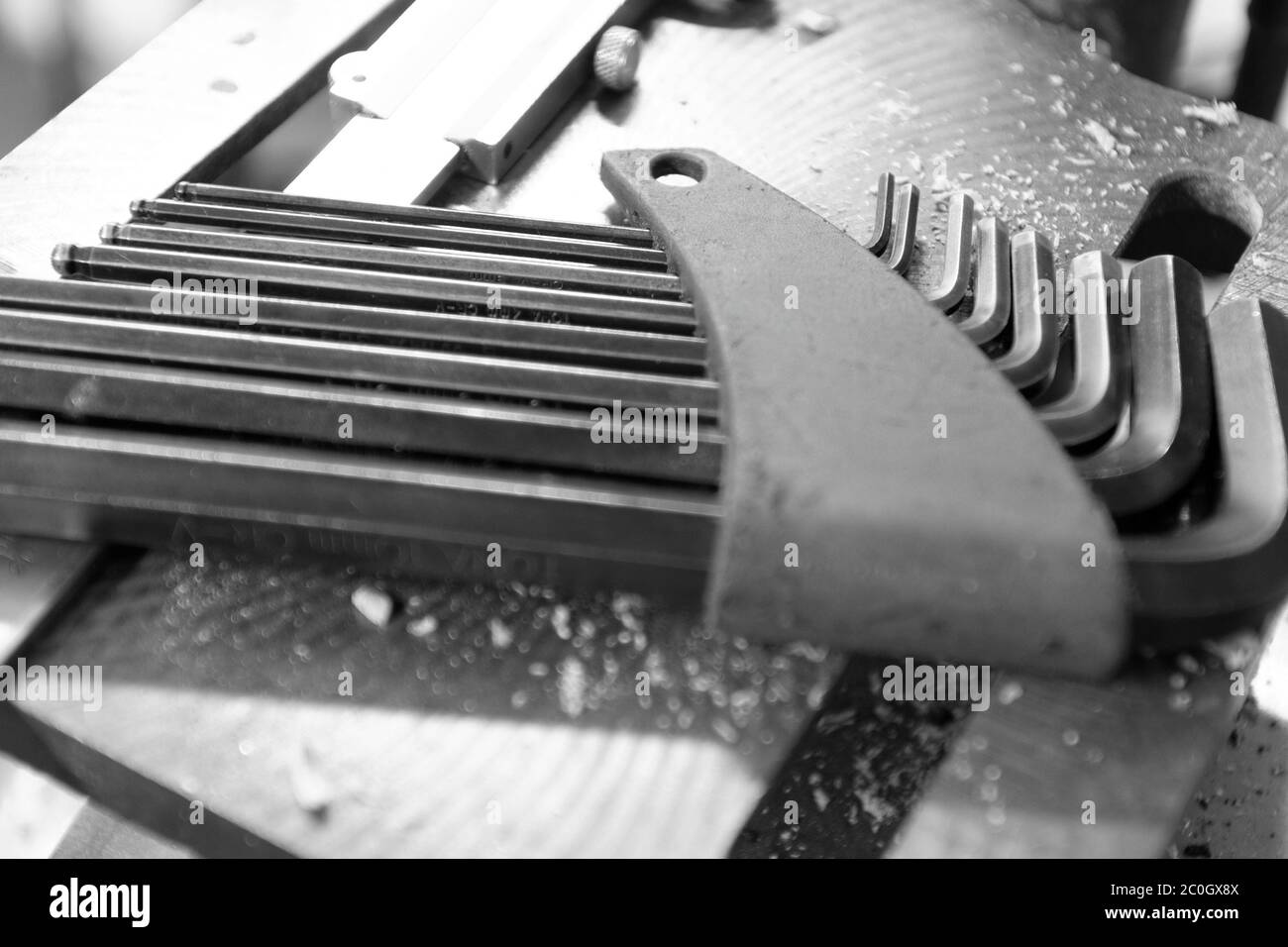 Set of tools over a wood panel on black and white Stock Photo - Alamy