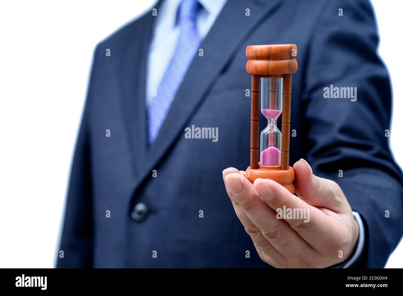 Hand holding hourglass hi-res stock photography and images - Alamy