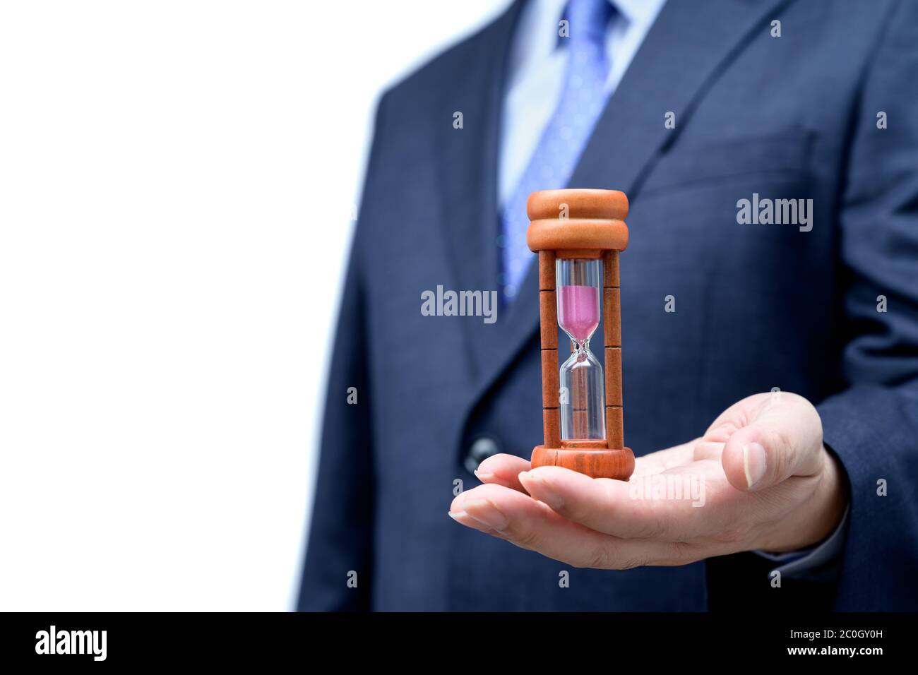 Businessman hand holding hourglass, Time management concept Stock Photo ... Businessman hand holding hourglass, Time management concept Stock Photo ...