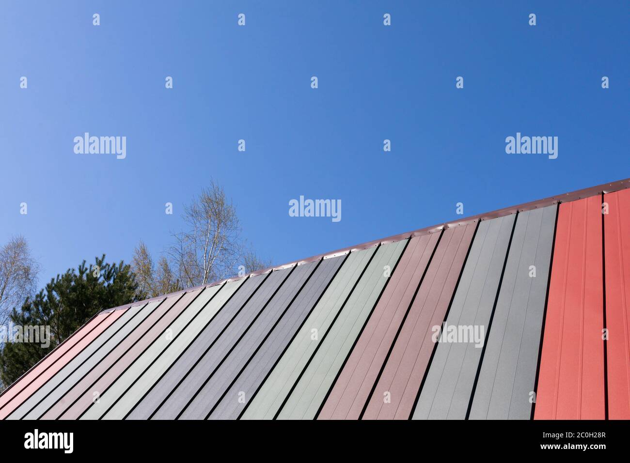 Colorful flat sheets are folded from time to time. Airtight roof in a ...