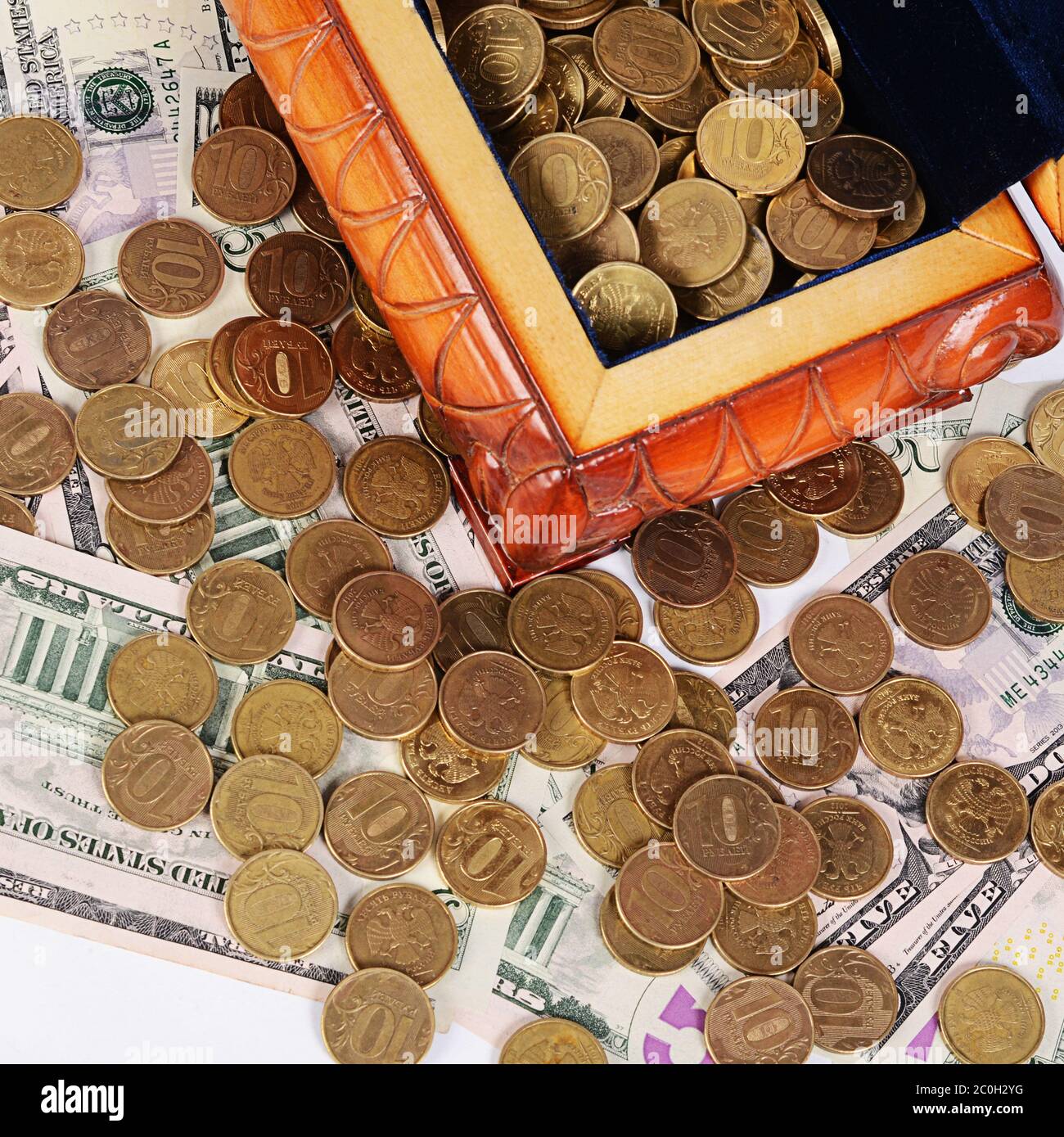 Coins and banknotes in the box Stock Photo - Alamy