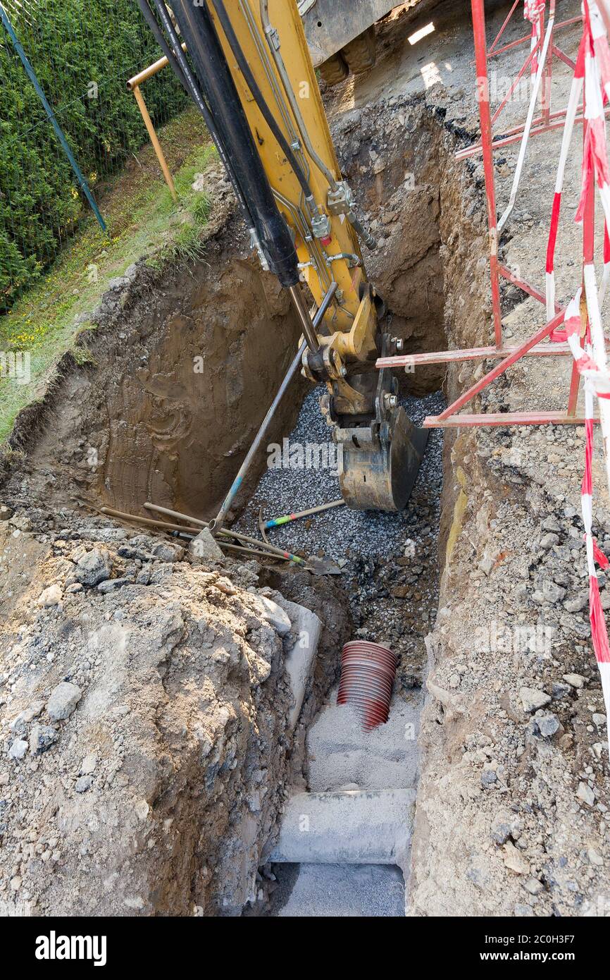 excavator on trench - constructing canalization Stock Photo - Alamy