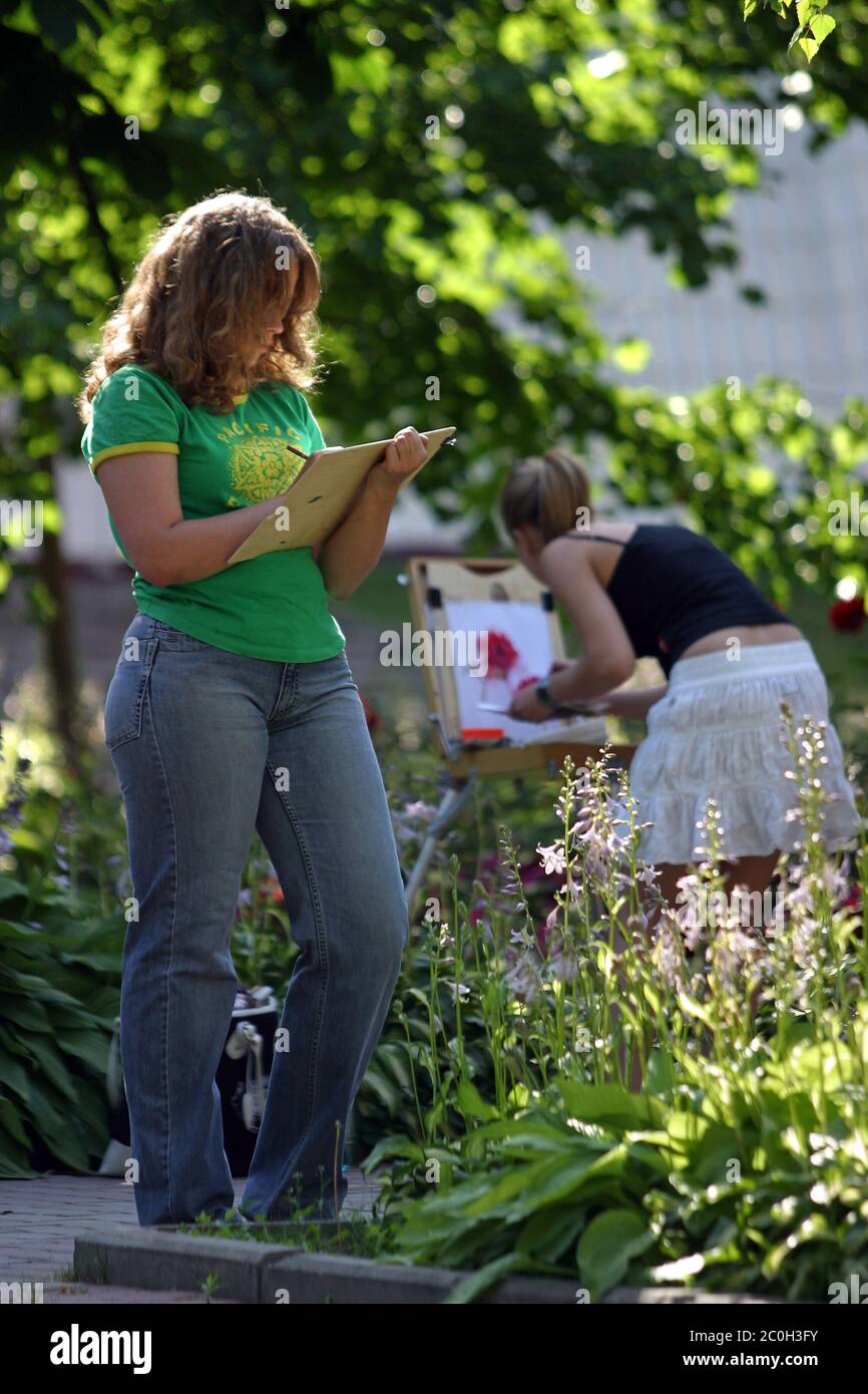 Two girls draw Stock Photo - Alamy