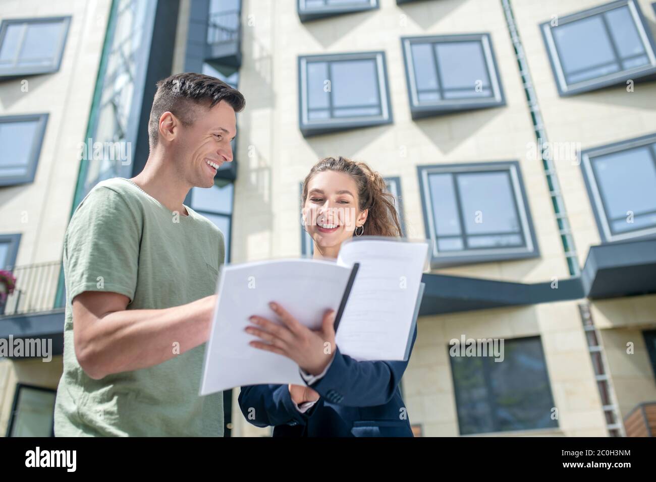 Elegant businesswoman explaining the agreement details to her client ...