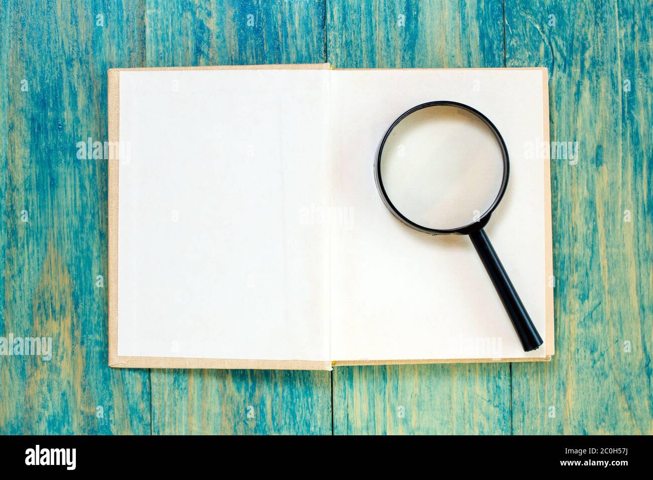 Open book magnifier hi-res stock photography and images - Alamy