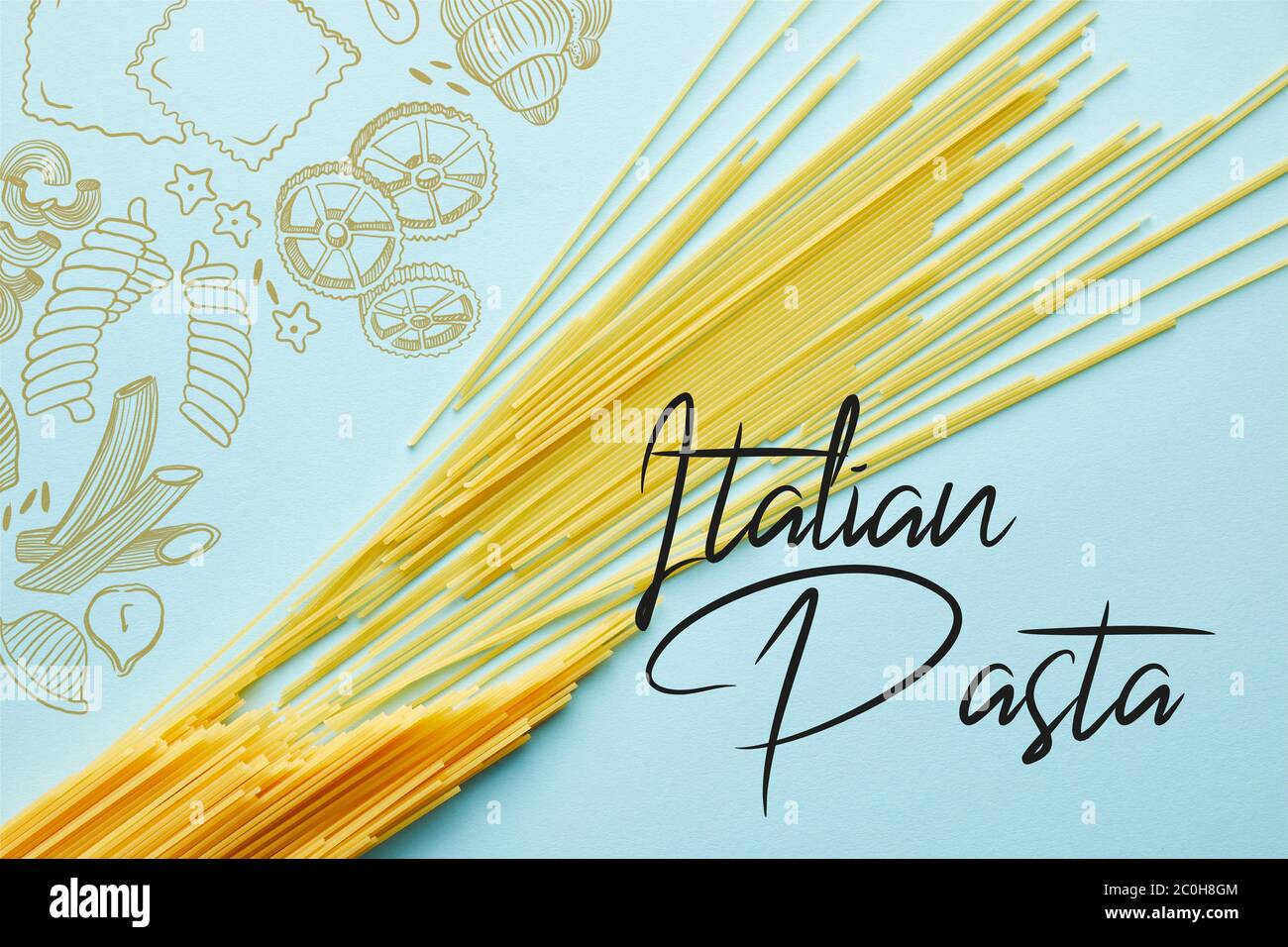 top view of raw spaghetti on blue background with Italian pasta ...