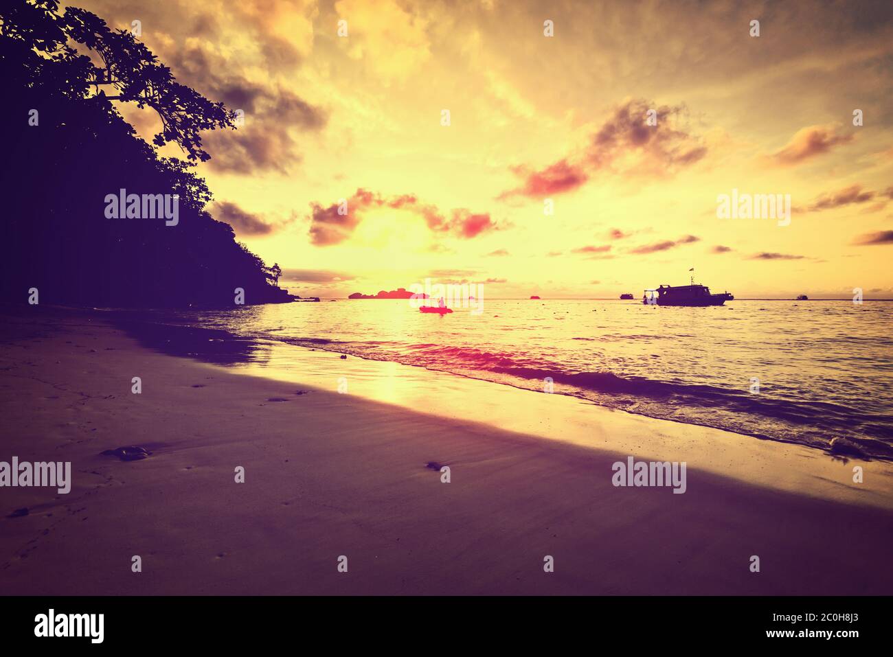 Sunrise over sea vintage style Stock Photo - Alamy