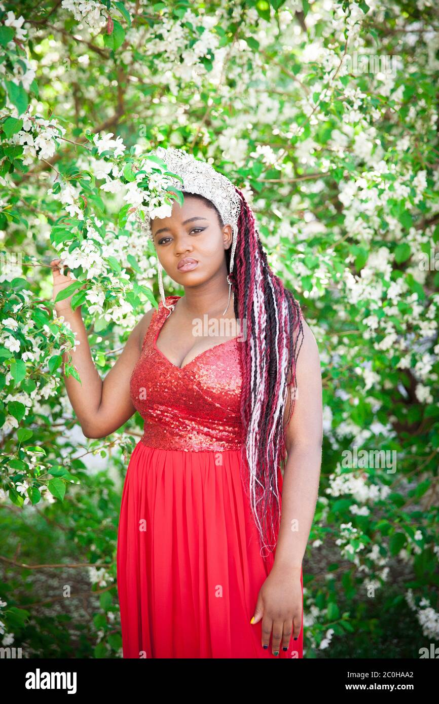 Queen in the crown and royal mantle. Lovely girl on the background of a ...