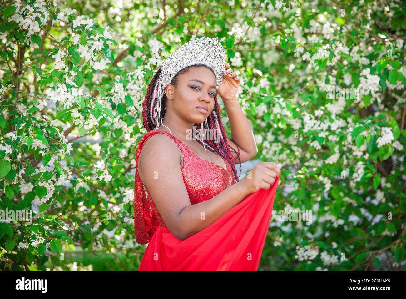 Queen in the crown and royal mantle. Lovely girl on the background of a ...