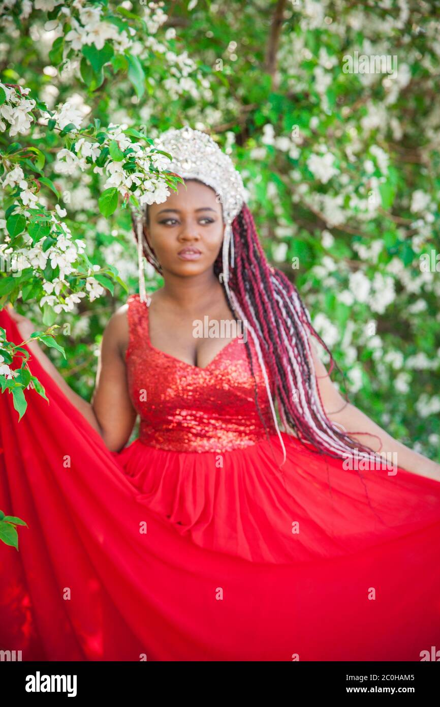 Queen in the crown and royal mantle. Lovely girl on the background of a ...