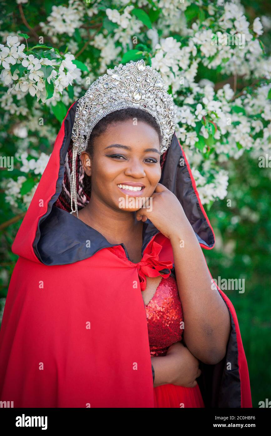 Queen in the crown and royal mantle. Lovely girl on the background of a ...