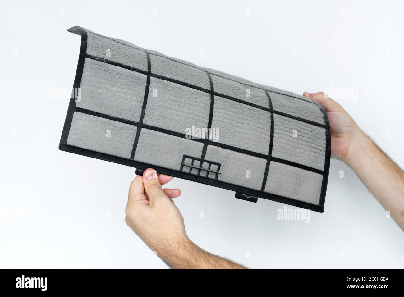 The guy cleans the filter of the home air conditioner from dust. Very ...