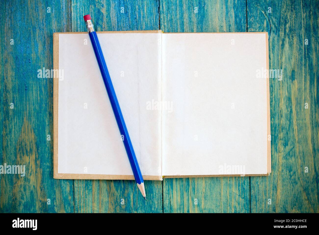 Open book and pencil Stock Photo - Alamy