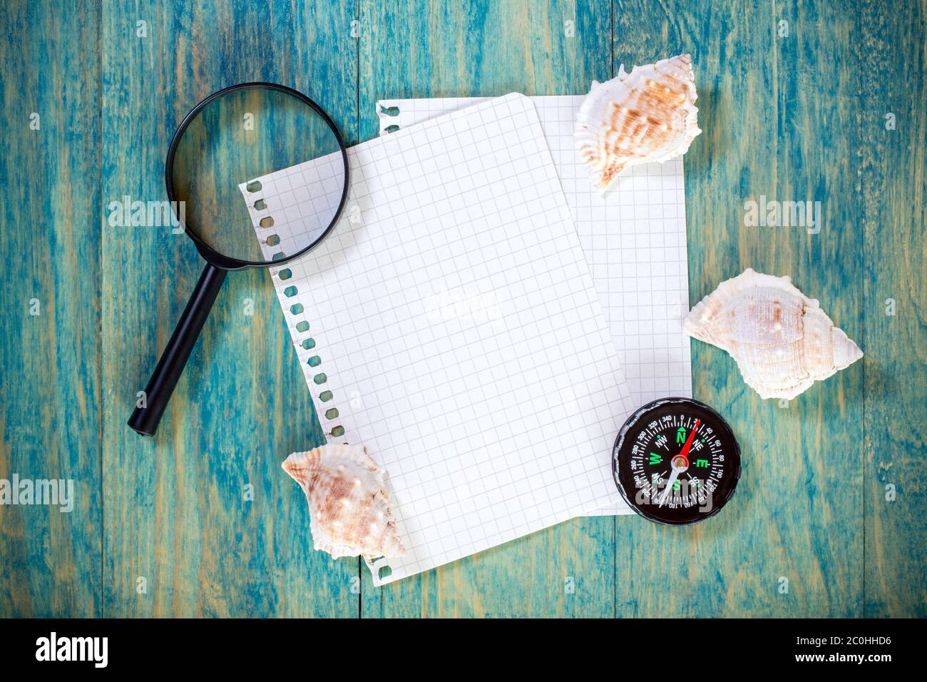 Magnifying glass and empty paper sheet Stock Photo - Alamy