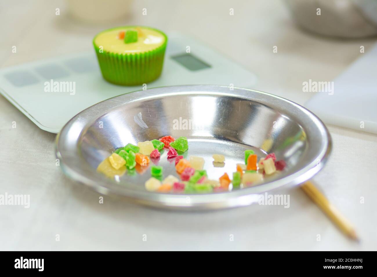 The process of making cupcakes. Creation of cakes by professional ...