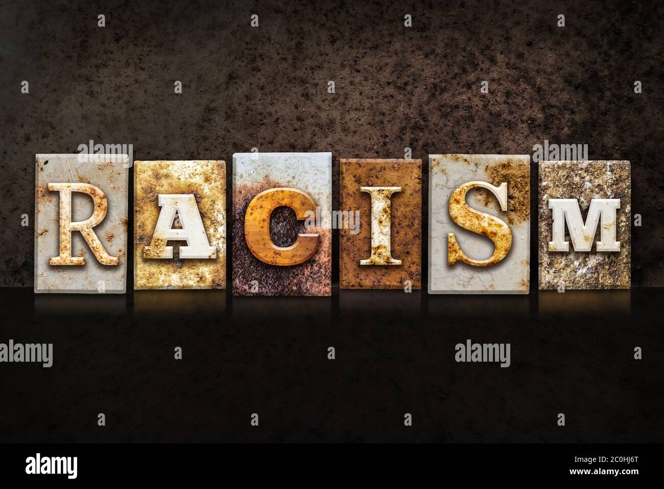 Racism Letterpress Concept on Dark Background Stock Photo - Alamy