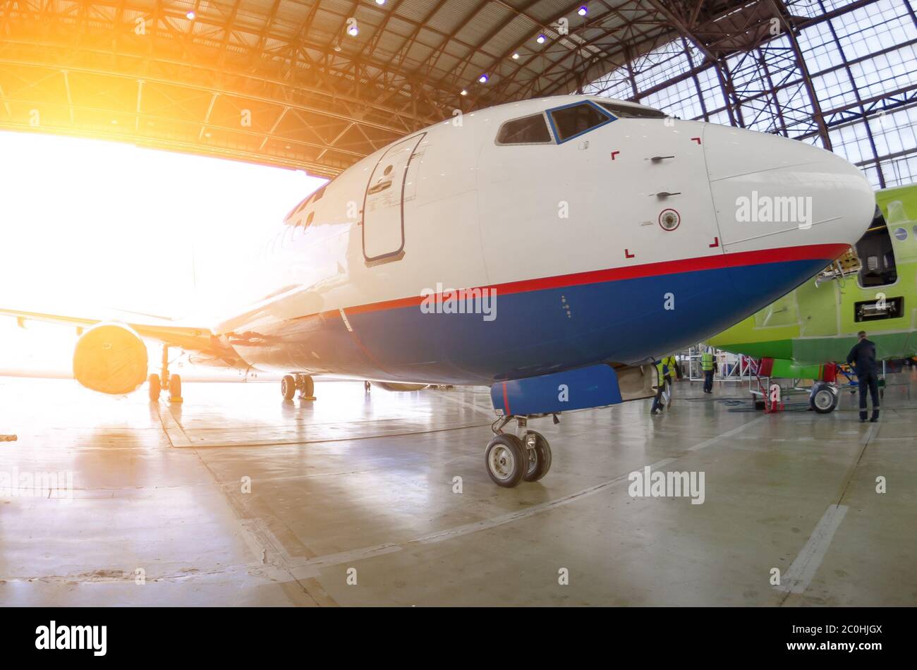 Roll-out of the aircraft from the hangar by a aerodrome tractor, after ...
