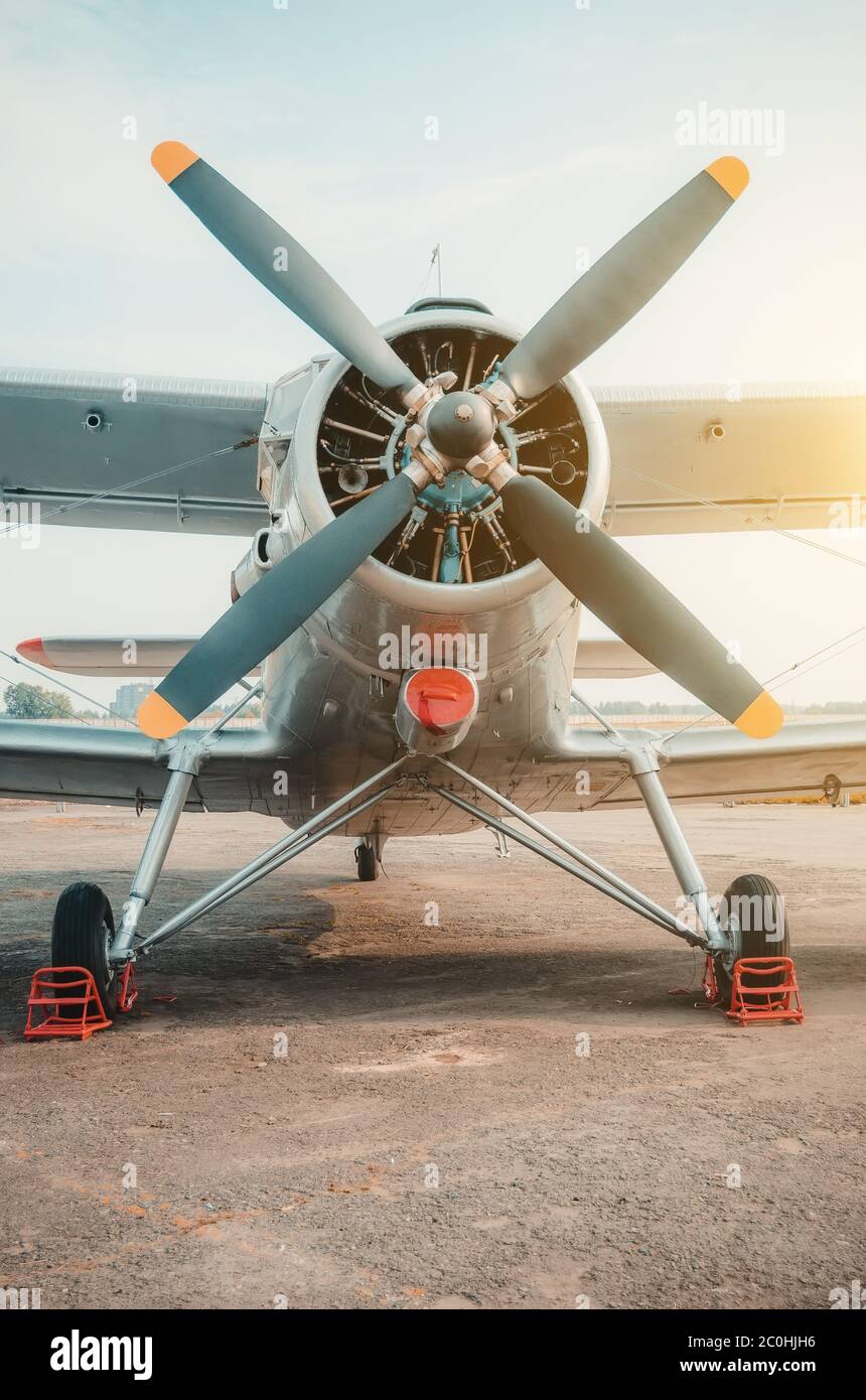 Old biplane, turboprop aircraft in the parking lot Stock Photo - Alamy