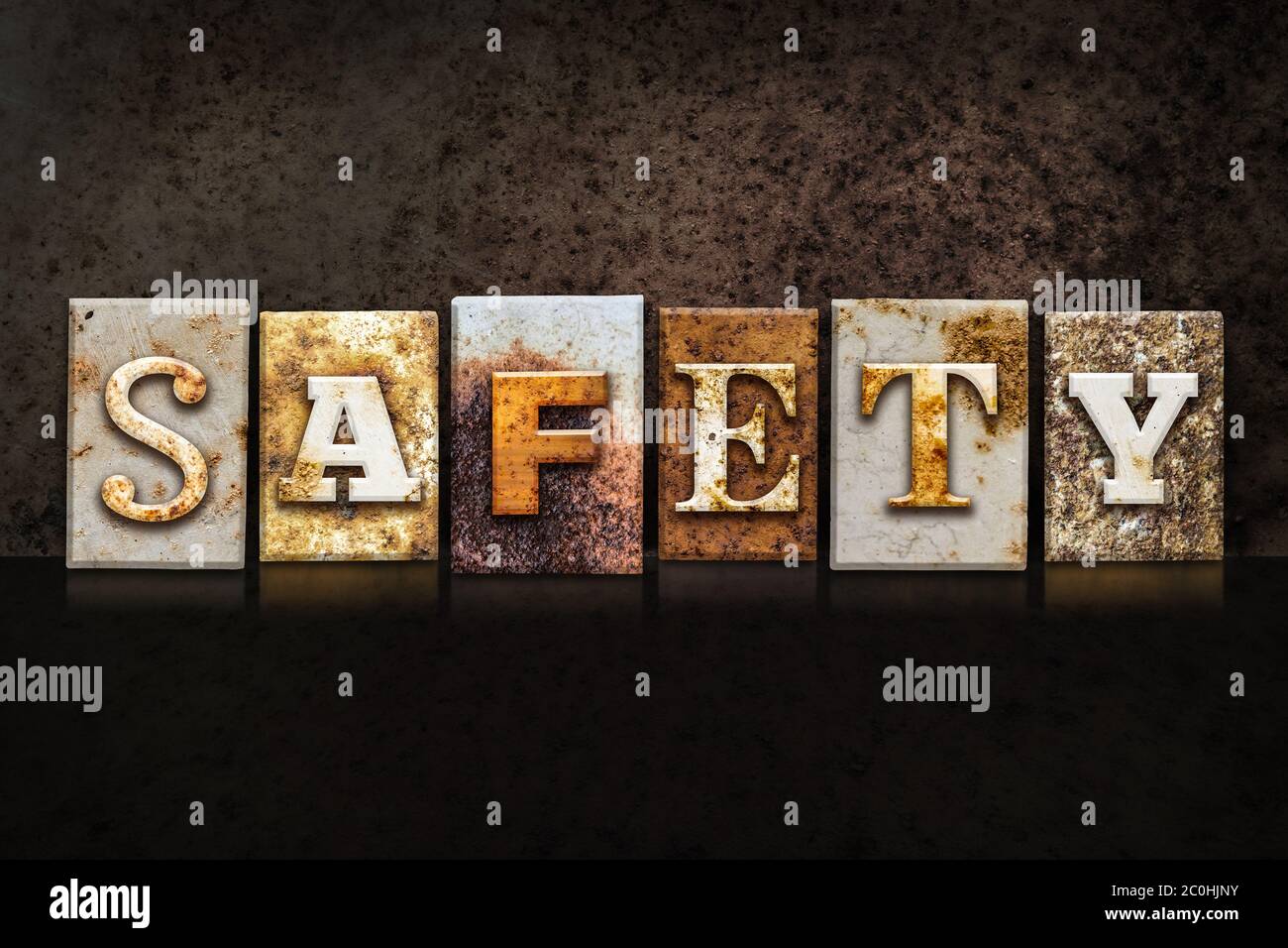 Safety Letterpress Concept on Dark Background Stock Photo - Alamy