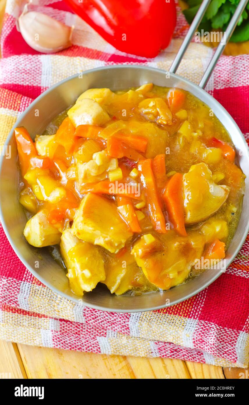 chicken with vegetable in metal plate Stock Photo - Alamy