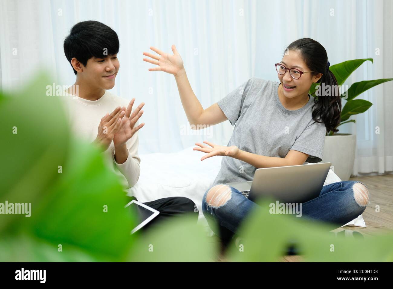 man woman friends using computer tablet. startup teamwork team feeling ...
