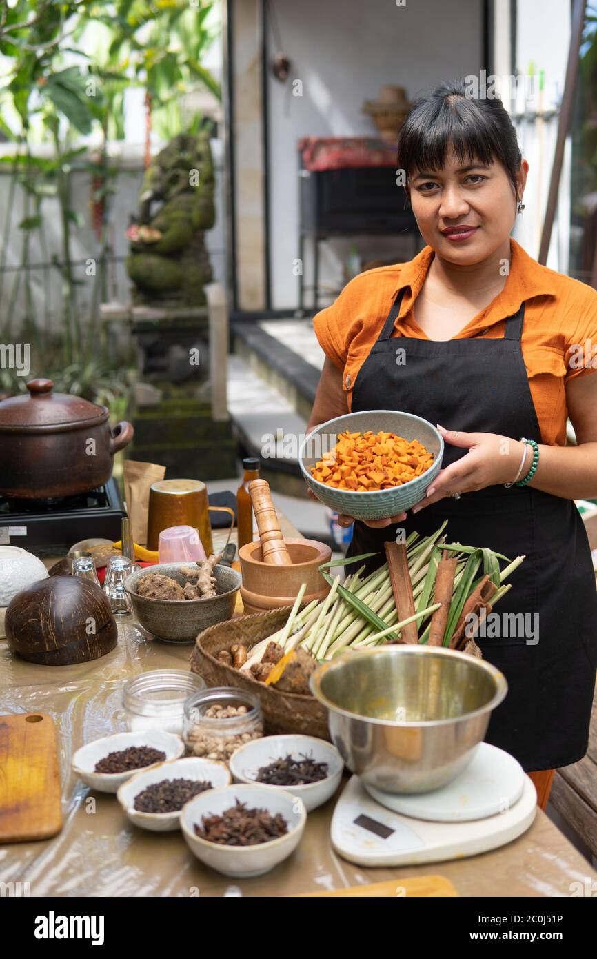 jamu herbal drink. asian woman jamu maker with spice ingredient Stock ...