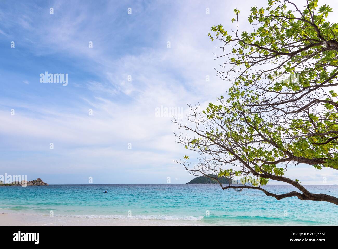 Beautiful landscape sky and blue sea under a green tree at beach of Koh ...